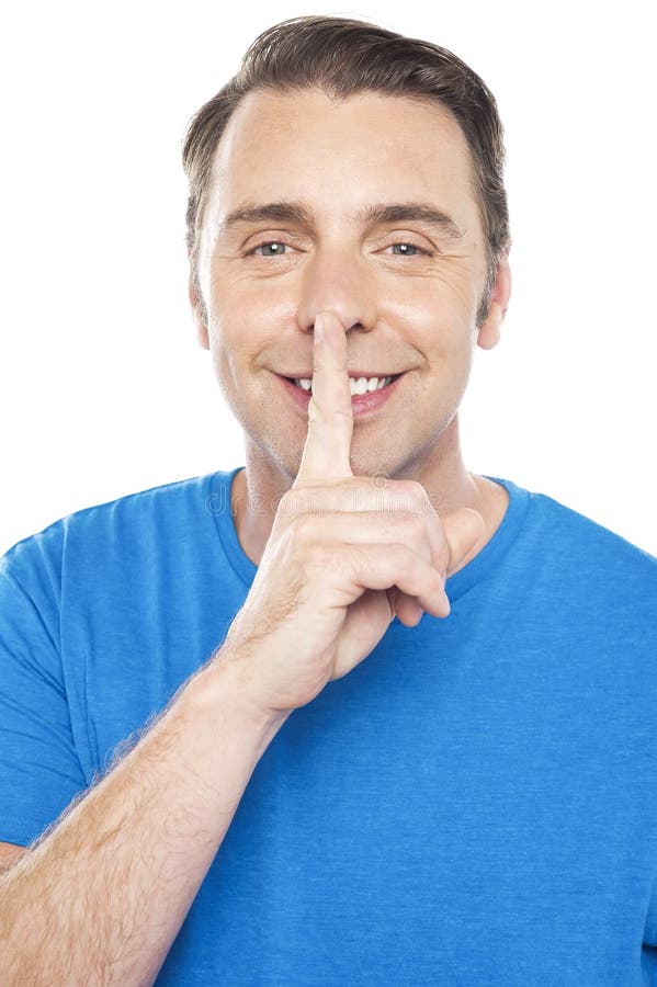Smiling Young Man Gesturing Silence Stock Photo - Image of adult ...