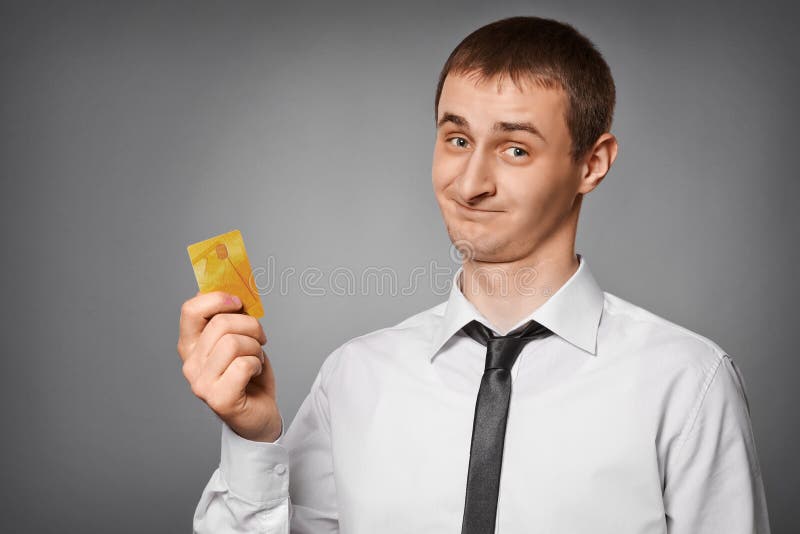 Smiling Young Man Holding a Credit Card Stock Image - Image of enjoy ...
