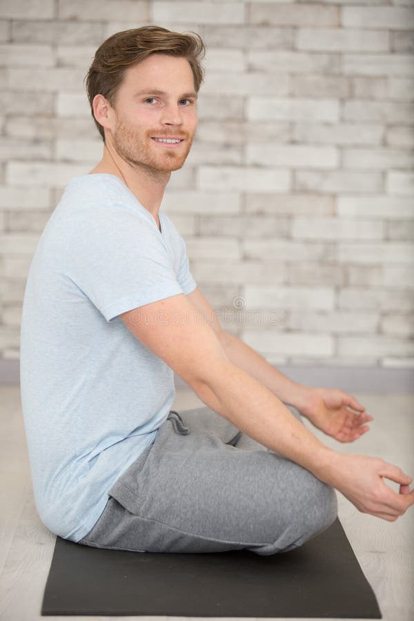 Smiling Young Man in Lotus Position Stock Image - Image of health ...