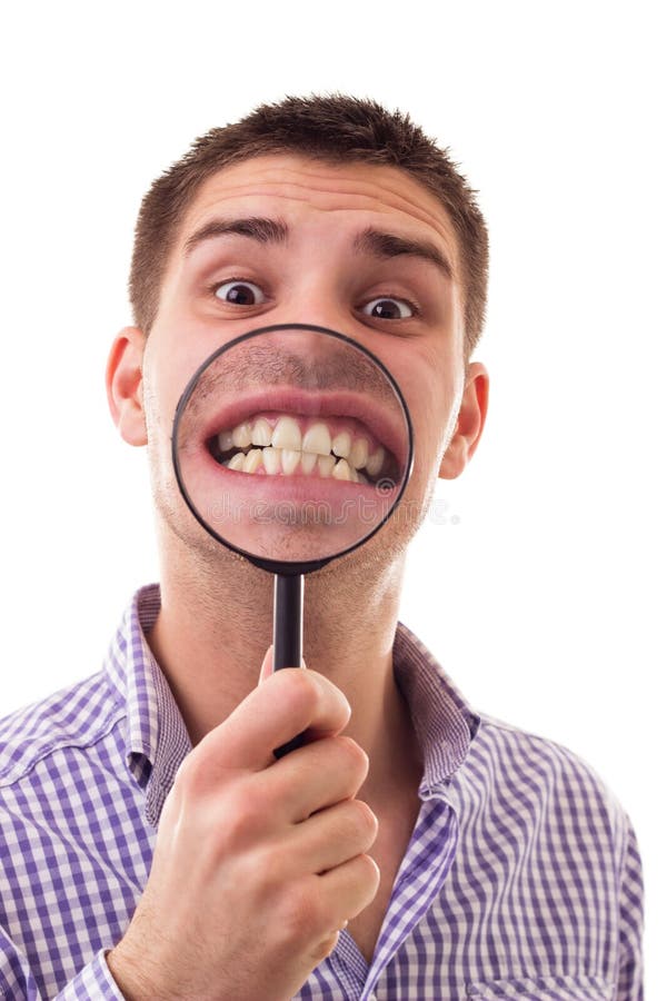 Smiling Young Man through Magnifying Glass Stock Photo - Image of ...