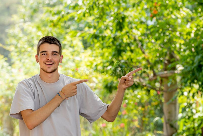 Man pointing outdoors stock image. Image of confident - 258985601