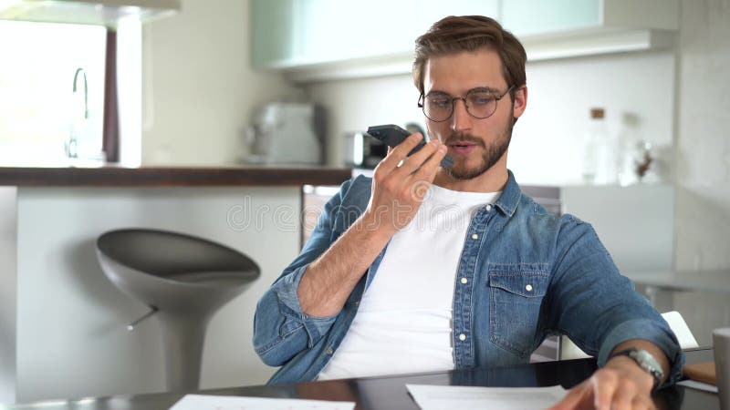 Smiling Young Man Recording Voice Message on Smartphone. Handsome Guy ...