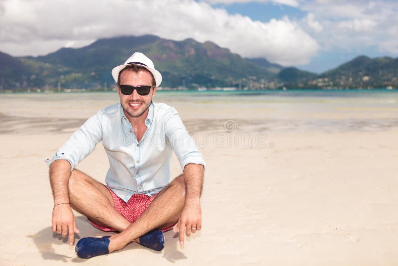 Smiling Young Man Sitting on the Beach Stock Photo - Image of fresh ...