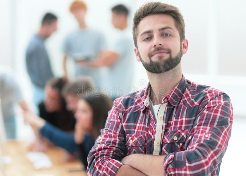 Smiling Young Man Standing in a Modern Office Stock Photo - Image of ...