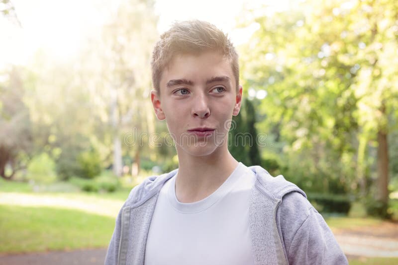 Smiling Young Man Standing in a Sun-washed Landscape Stock Image ...