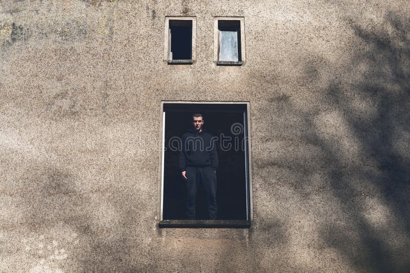 Young Man Stands in an Open Window of a House Stock Photo - Image of ...