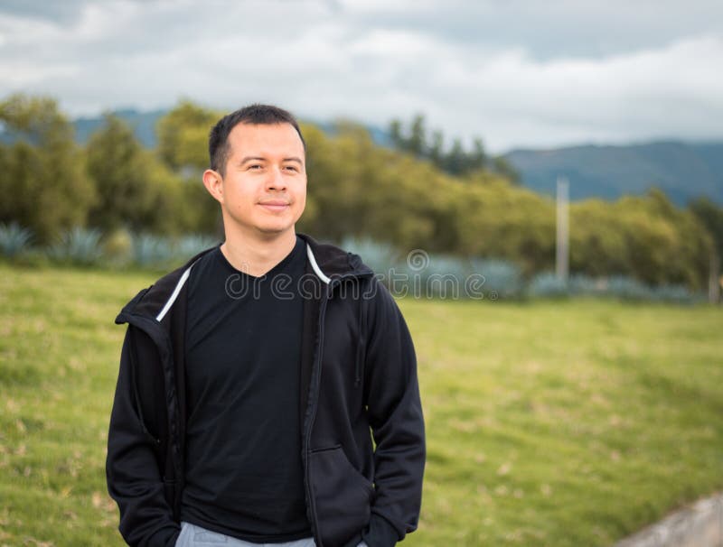 Smiling Young Man Taking a Walk Outdoors Stock Image - Image of grass ...