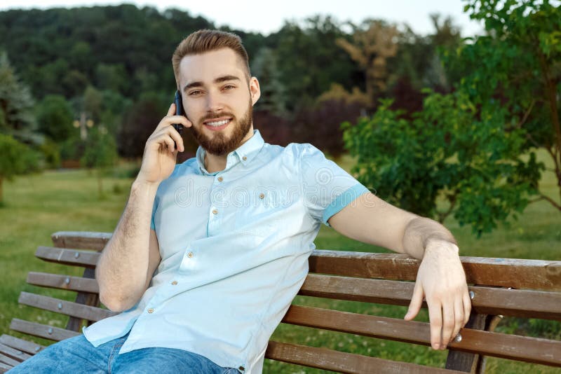 Smiling Young Man Talking on the Cellphone Stock Image - Image of phone ...