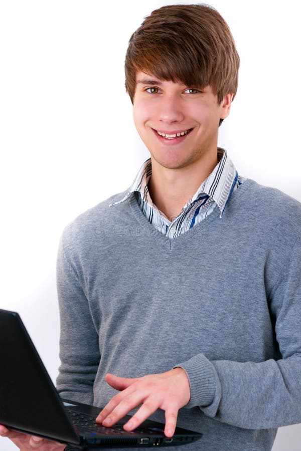 Smiling Young Man Using Laptop Stock Image - Image of adult, happiness ...