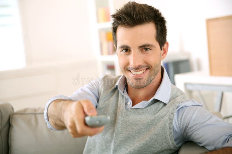 Smiling Young Man Watching Tv Stock Image - Image of handsome, remote ...