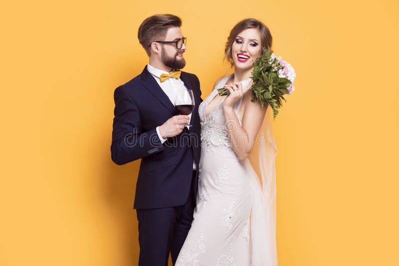 Smiling Young Newly Married on a Yellow Background Stock Image - Image ...