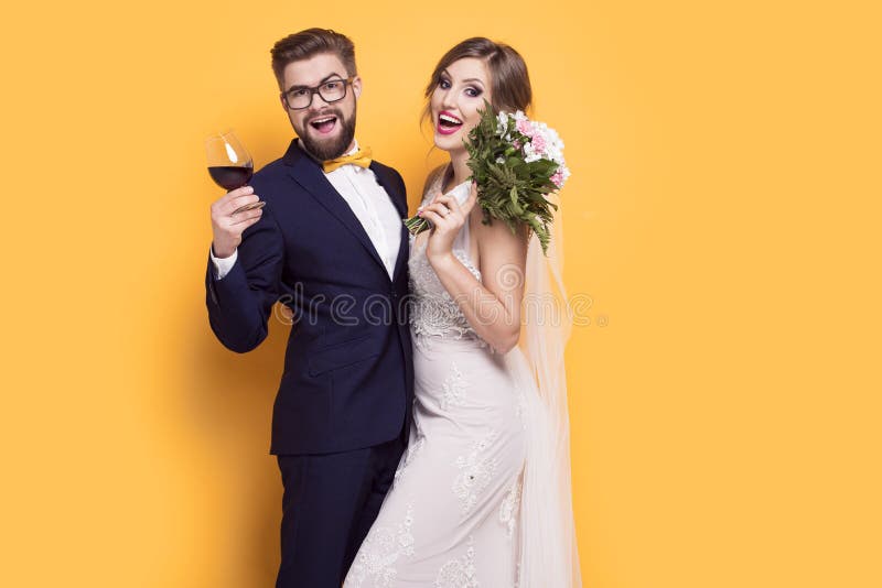Smiling Young Newly Married on a Yellow Background Stock Image - Image ...