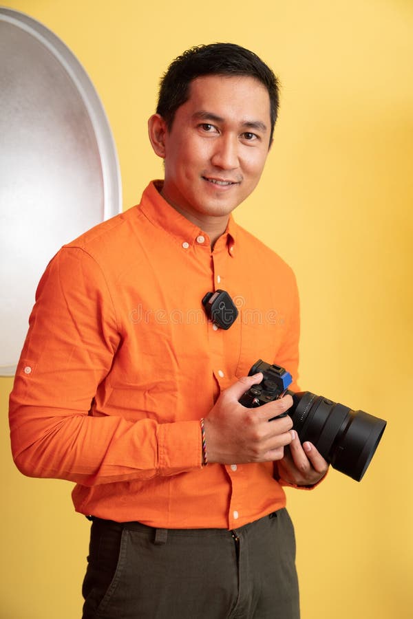 Smiling Young Photographer Holding Professional Camera and Micro ...