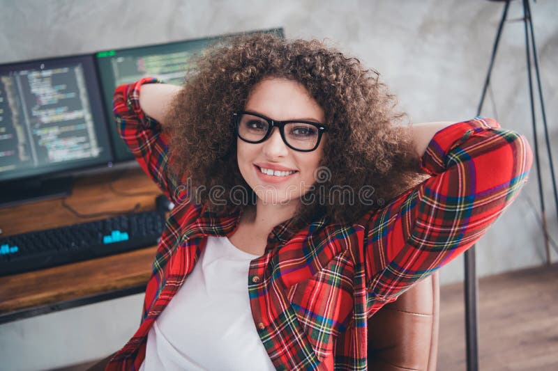 Smiling Young Professional Programmer Relaxing in Modern Workspace with Coding Screens Stock ...