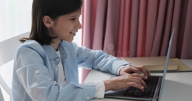Smiling Young Schoolboy Using Laptop at the Table Stock Video - Video ... Smiling Young Schoolboy Using Laptop at the Table Stock Video - Video ...