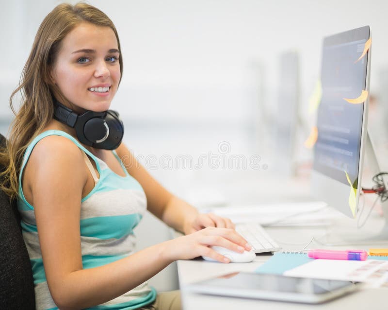 Smiling Young Student Working in the Computer Room Stock Image - Image ...