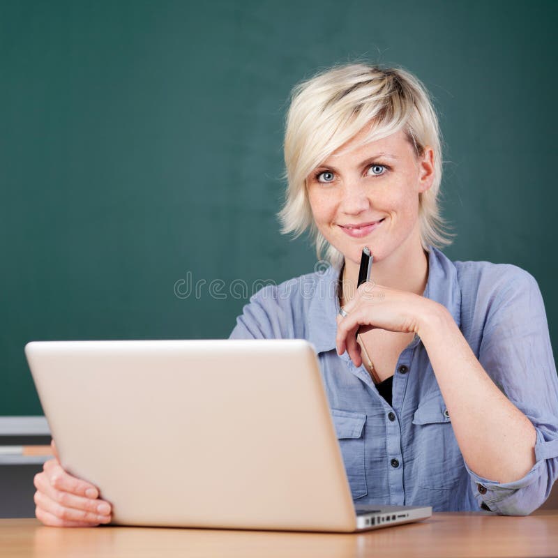 Smiling Young Teacher Using Laptop at School Stock Image - Image of ...
