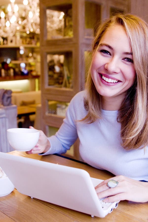 Smiling Young Woman with Computer Stock Photo - Image of drink, cafe ...