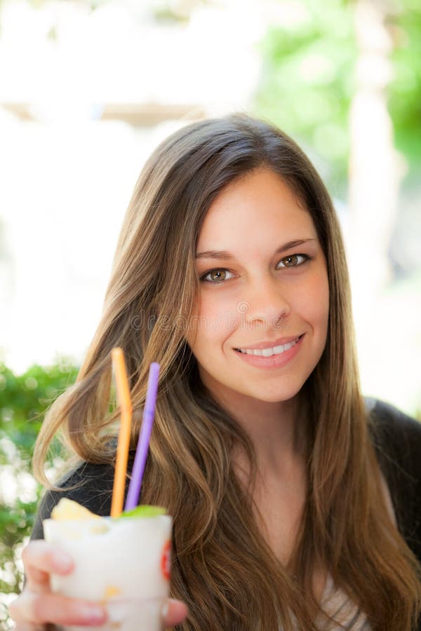 Smiling Young Woman Drinking a Cocktail Stock Photo - Image of person ...
