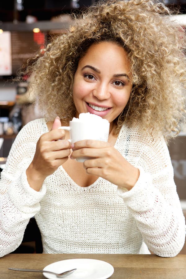 Smiling Young Woman Drinking Coffee in Cafe Stock Photo - Image of ...