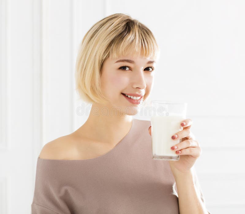Smiling Young Woman Drinking Milk Stock Image - Image of fresh, morning ...