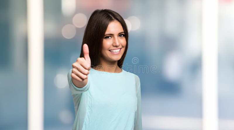 Smiling Young Woman Giving Thumbs Up Stock Image - Image of pretty ...