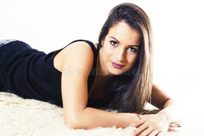 Smiling Young Woman Laying on a Rug Stock Image - Image of girl, pretty ...