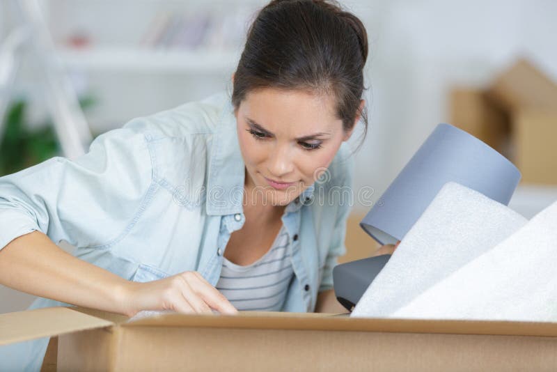 Smiling Young Woman Opening Cardboard Box Stock Image - Image of ...