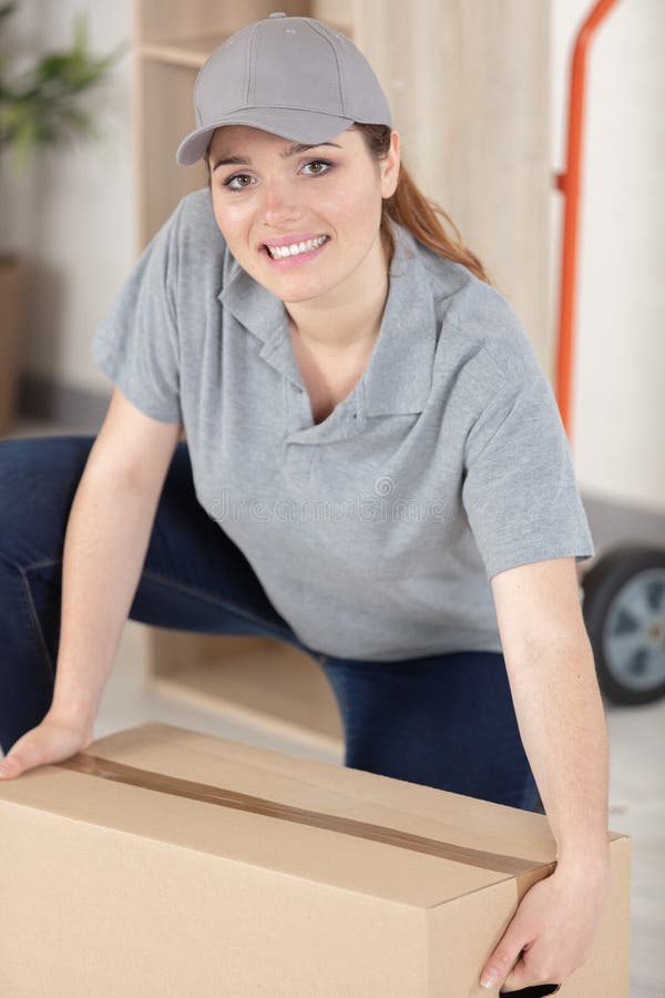 Smiling Young Woman Opening Cardboard Box Stock Photo - Image of ...