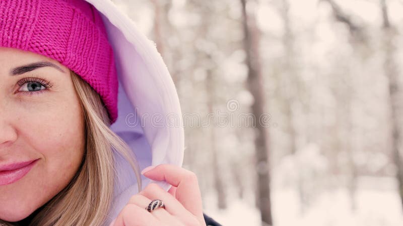 Smiling Young Woman Outdoors in Winter. Half of a Woman`s Face Close Up ...