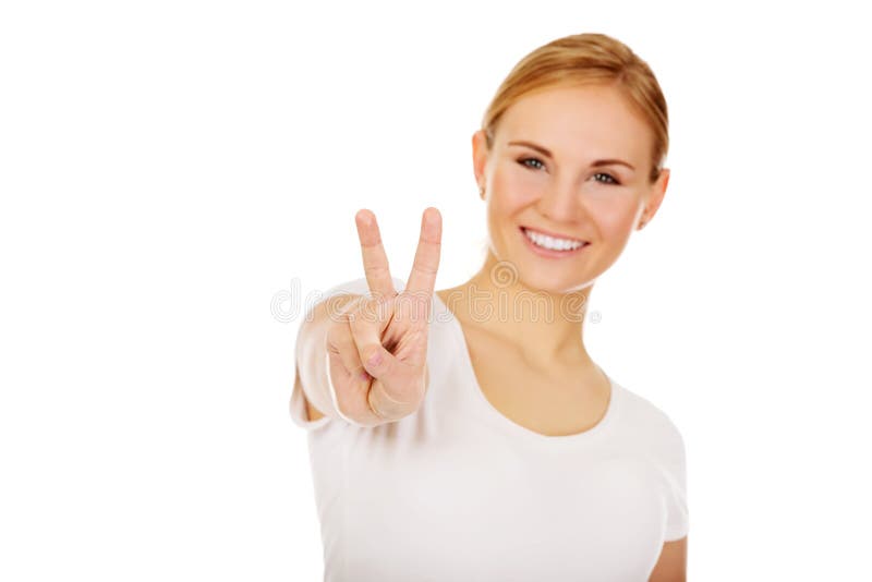 Smiling Young Woman Showing the Victory Sign Stock Photo - Image of ...