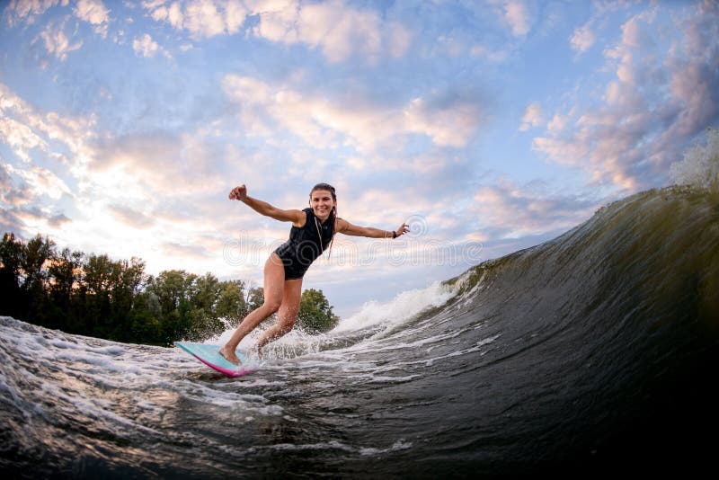 Back View Of Woman Lying On Wakeboard On Water Stock Image Image Of