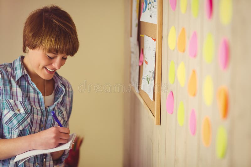 Smiling Young Woman Taking Notes Stock Photo - Image of freshness ...