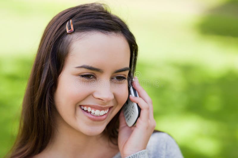 Smiling Young Woman Using Her Mobile Phone Stock Image - Image of ...