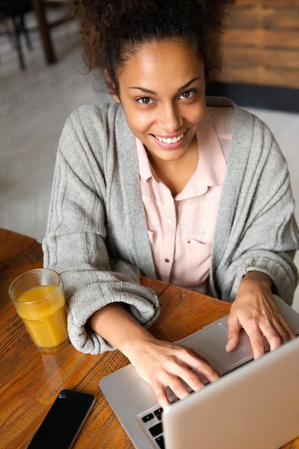 Smiling Young Woman Using Laptop at Home Stock Image - Image of ...