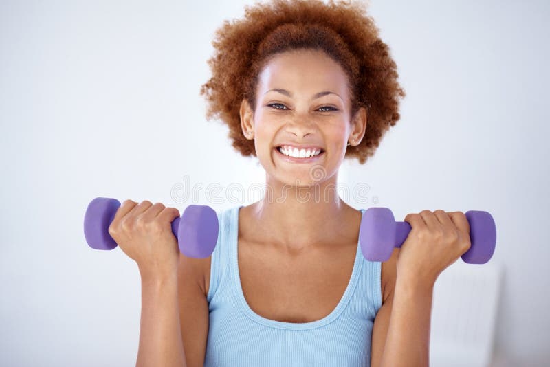 Smiling Young Woman Working Out with Dumbells Stock Photo - Image of ...