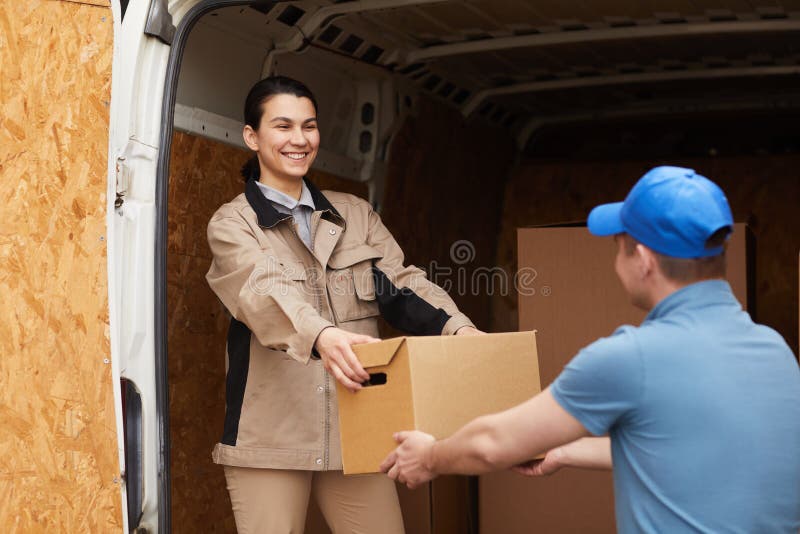 People unloading boxes stock photo. Image of service - 189108016