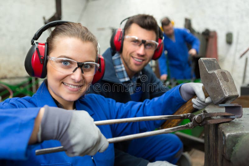 Smiling Young Woman Learning Metal Work Stock Image - Image of happy ...