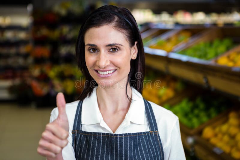 Smiling Young Worker with Thumbs Up Stock Photo - Image of leisure ...
