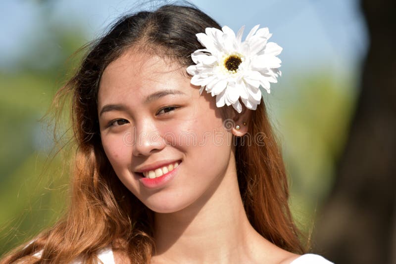 Smiling Youthful Asian Female with a Daisy Stock Image - Image of smile ...
