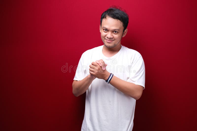 Smirk Smiling Face of Young Asian Man with Greeting Hand Stock Photo ...