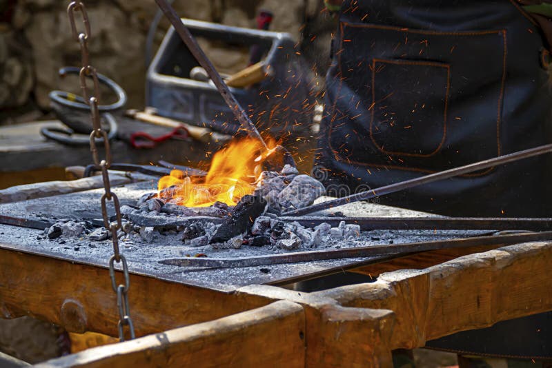The Smith Heating the Metal in the Fire Stock Image - Image of industry ...