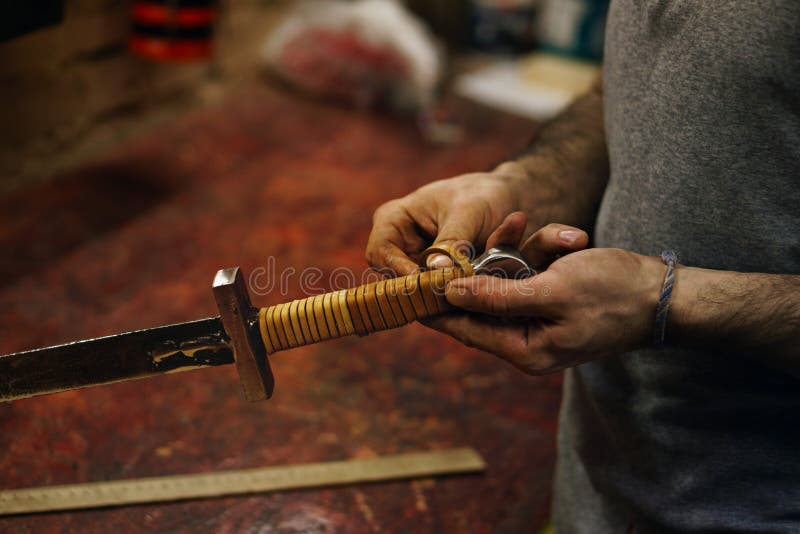 Blacksmith Makes Leather Winding Sword Stock Image - Image of industry ...