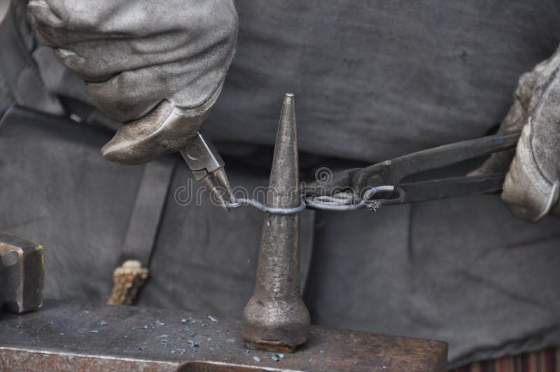 Smith Working with Wirde and Tongs Stock Image - Image of working ...