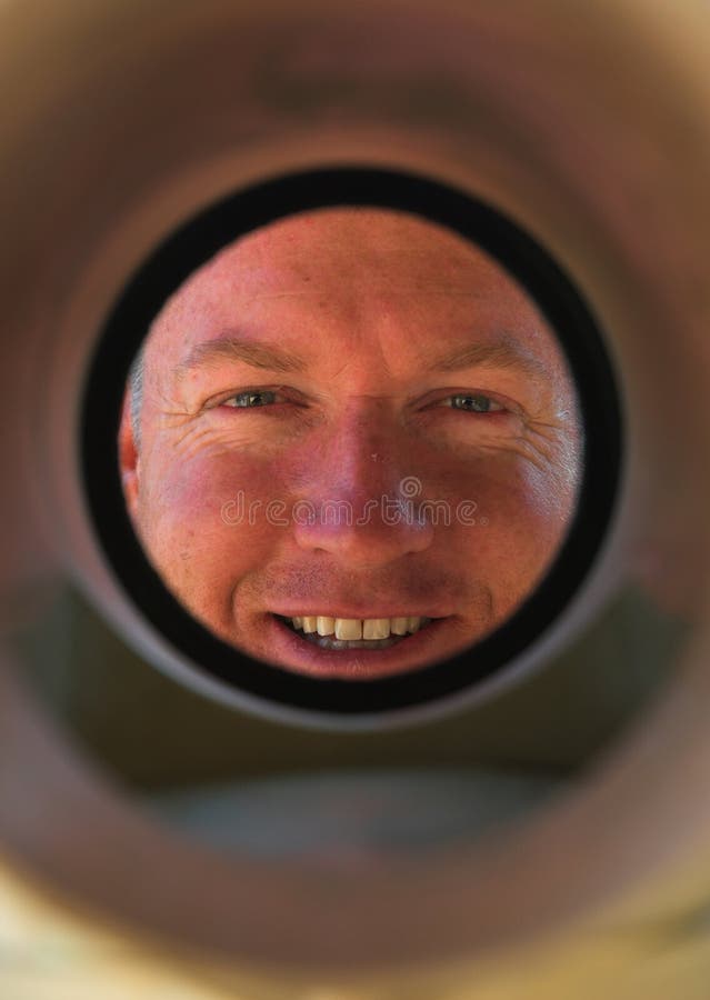 Smling Plumber Looking Down Drain Pipe Stock Image - Image of business ...