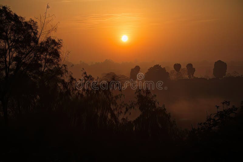 Smoggy Sunset, with the Sun Peeking through the Dense Fog Stock ...