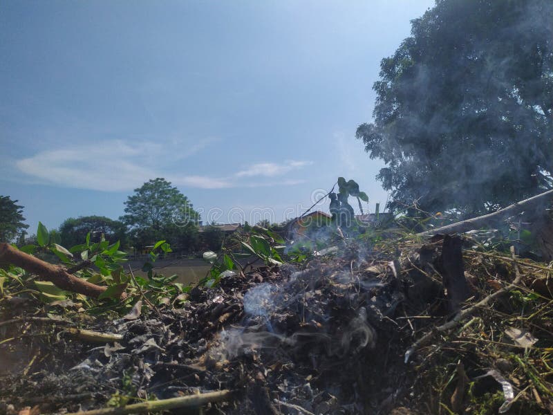 Smoke from Burning Garbage Against a Clear Sky. Smoke Causes ...