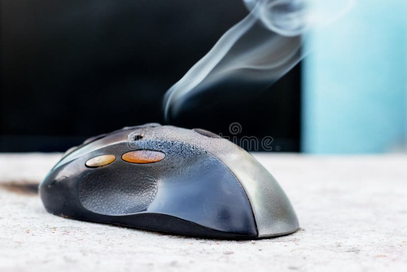 Smoke is Coming from the Computer Mouse Near the Computer Due To a ...