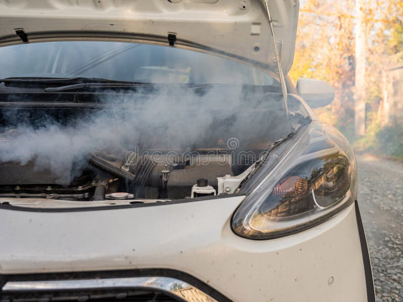 Smoke is Coming from Under the Hood of the Car. Stock Photo - Image of ...