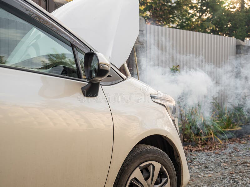 Smoke is Coming from Under the Hood of the Car. Stock Photo - Image of ...